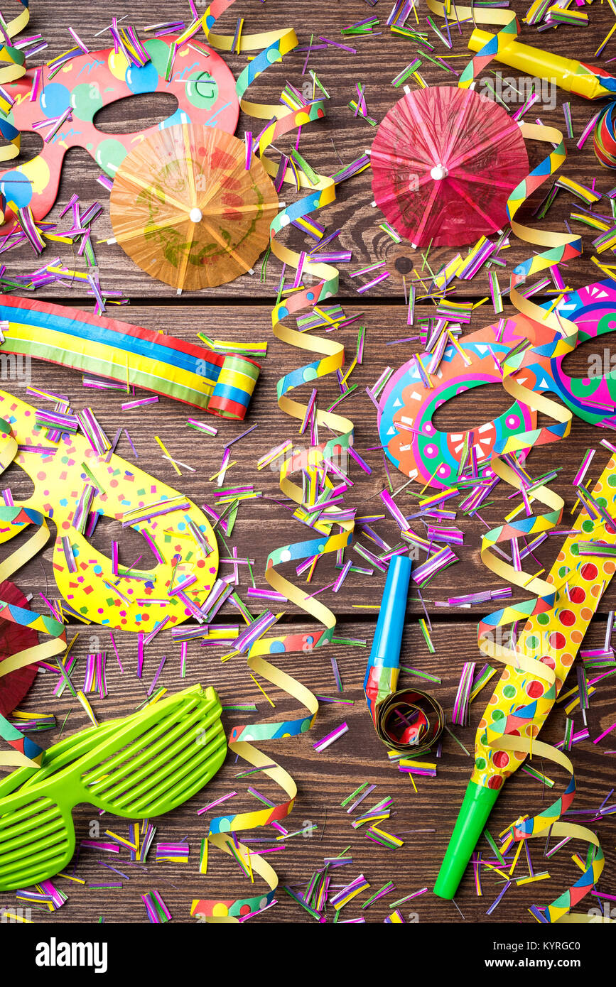 Colorful party background on wooden table Stock Photo - Alamy