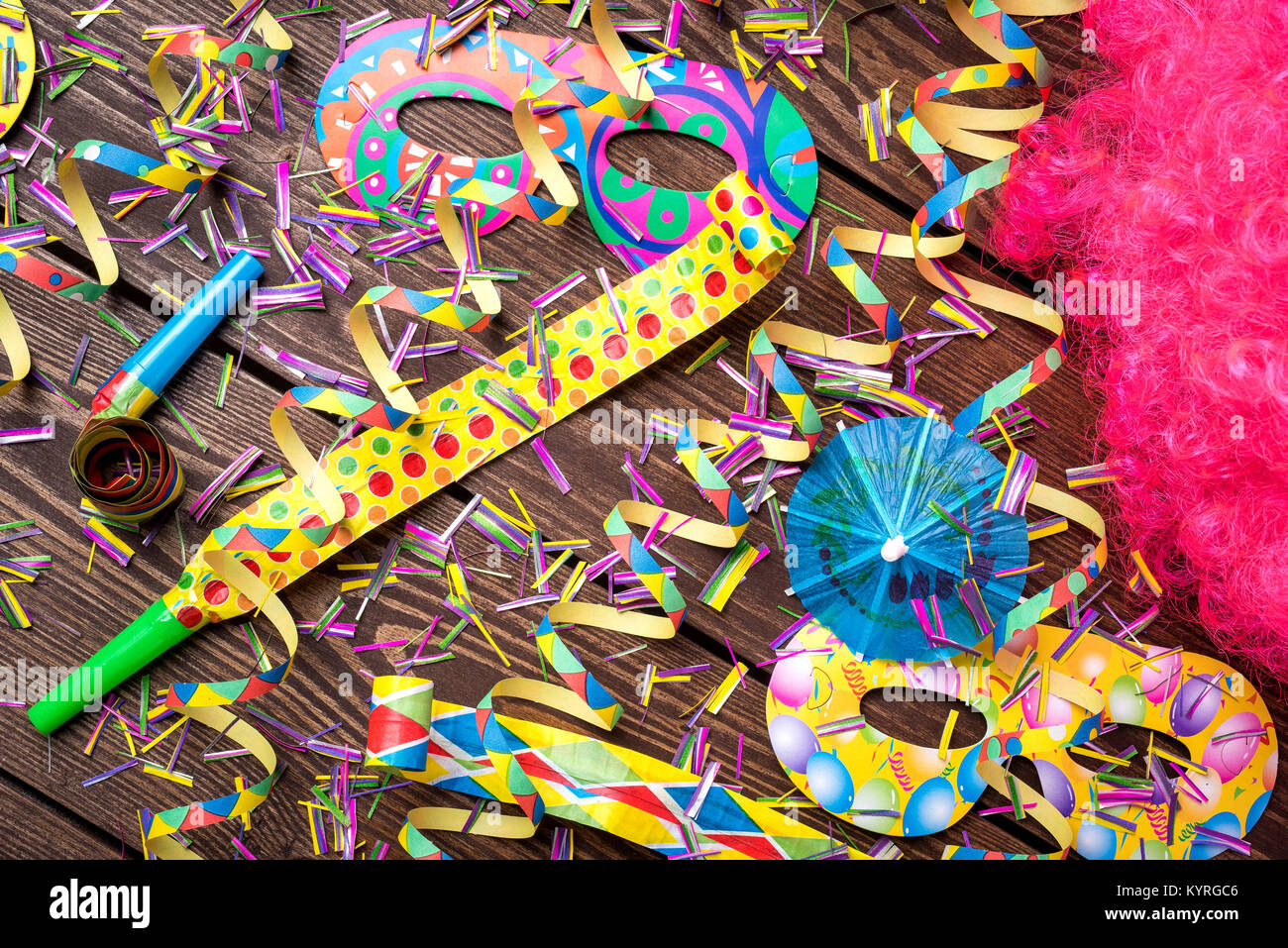 Colorful party background on wooden table Stock Photo - Alamy