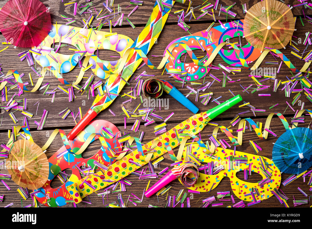 Colorful party background on wooden table Stock Photo - Alamy