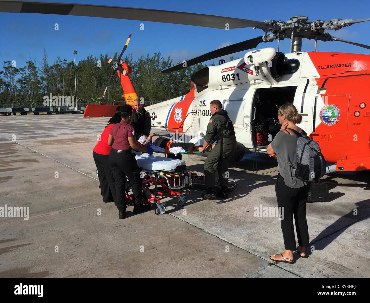 Coast Guard crewmembers aboard an MH-60 Jayhawk helicopter from Air ...