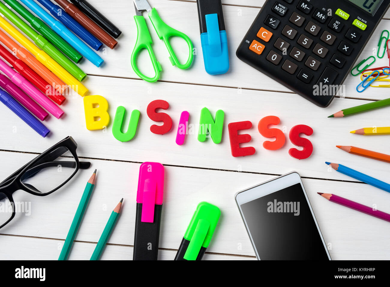 Office desktop with business word Stock Photo - Alamy