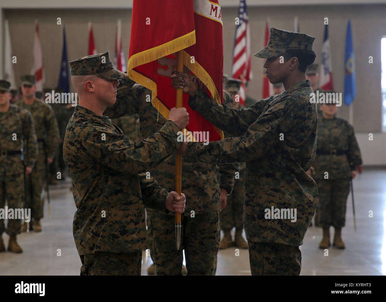 U.S. Marine Corps Sgt. Maj. Robin C. Fortner, right, out-going director ...