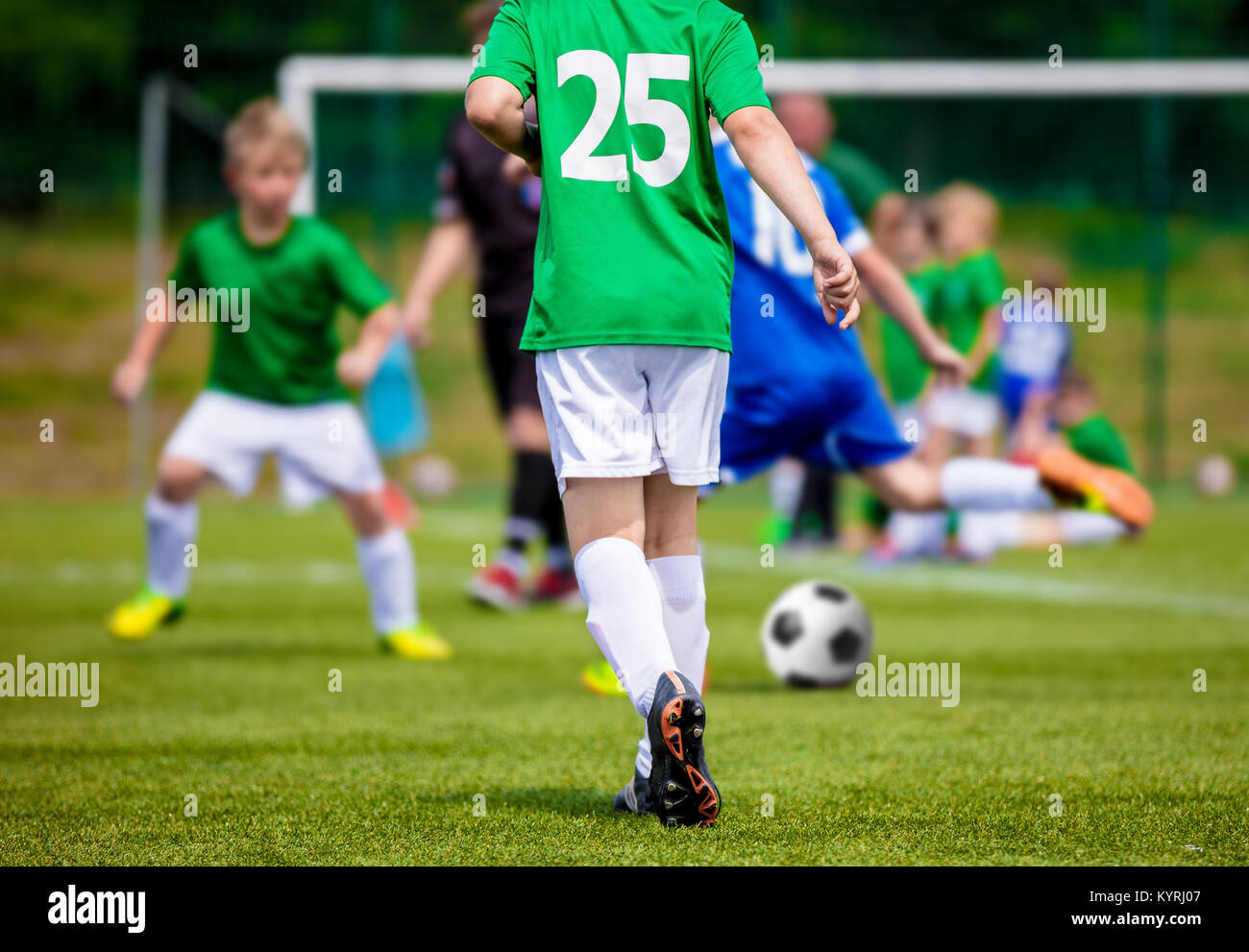 Youth Football Soccer Match. Boys Kicking Soccer Ball. Young Soccer ...
