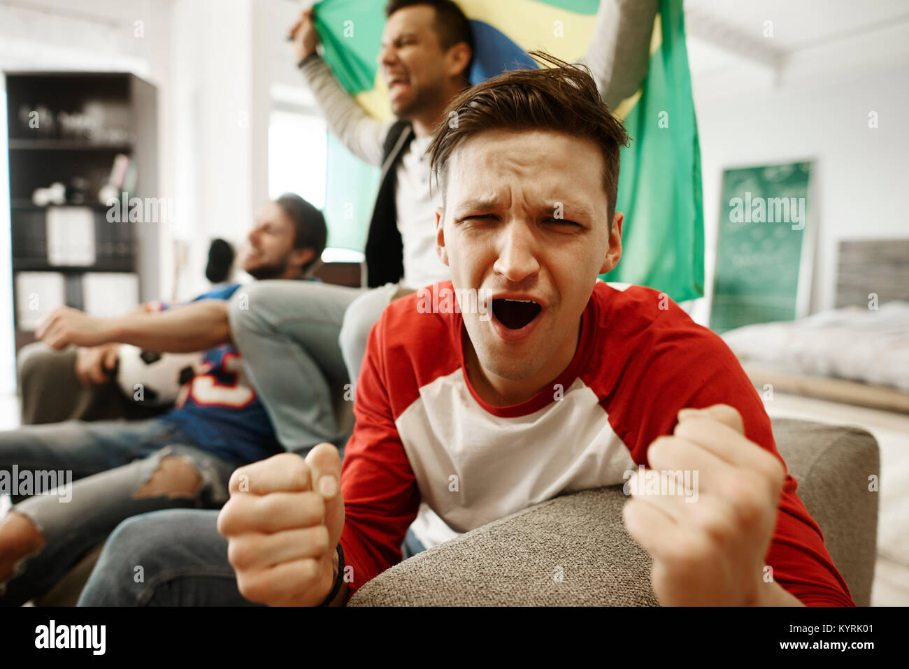 Disappointed man watching failure team hi-res stock photography and ...