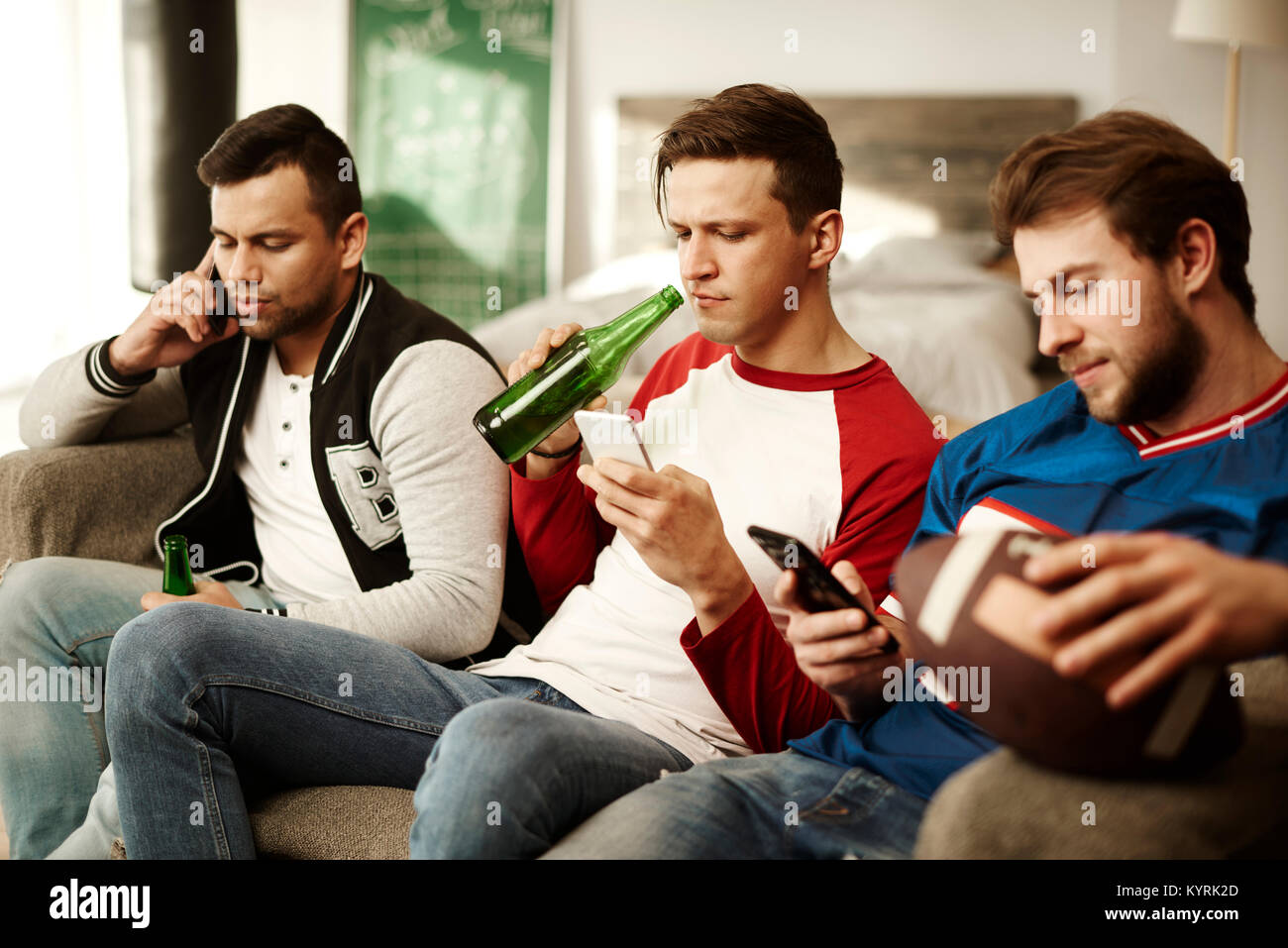 Using smartphone watching tv hi-res stock photography and images - Alamy