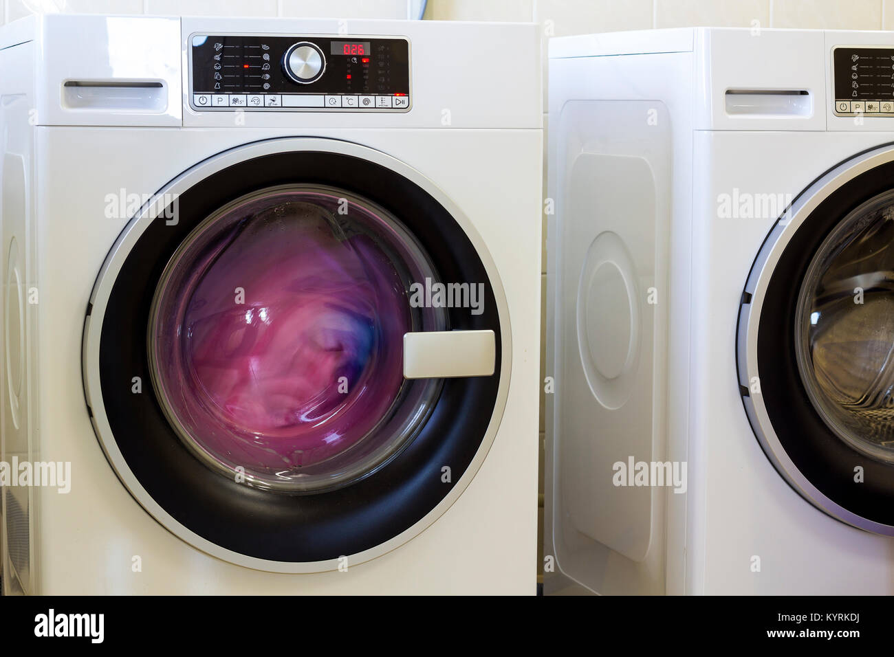 Colorful clothes and towels in washing machine Stock Photo - Alamy