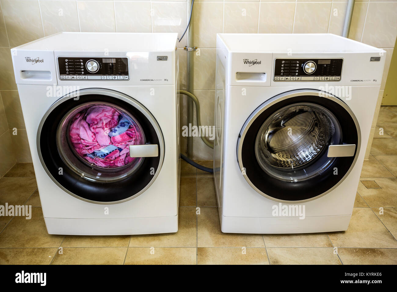 Colorful clothes and towels in washing machine Stock Photo - Alamy