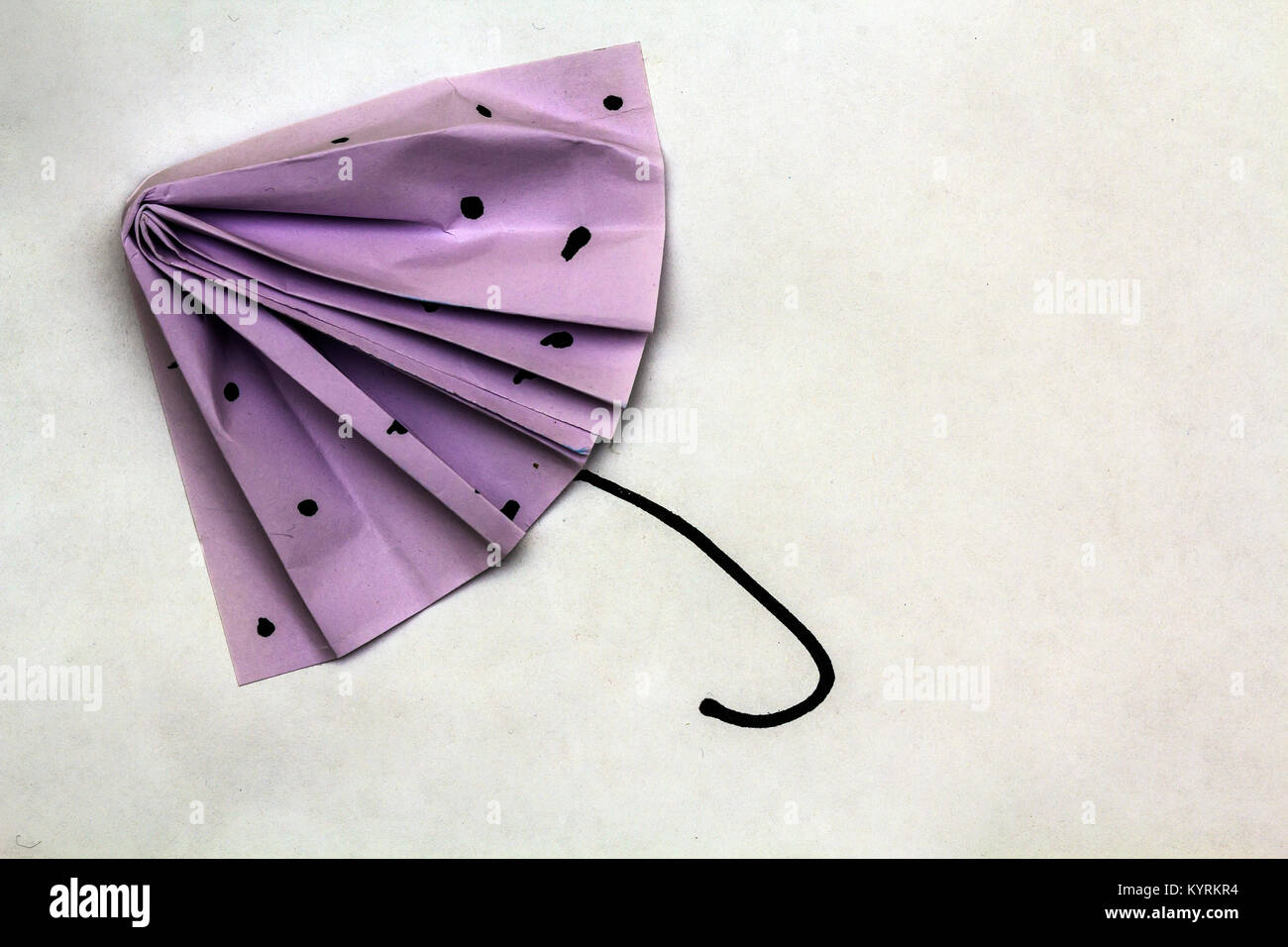 Small purple umbrella made from paper Stock Photo - Alamy