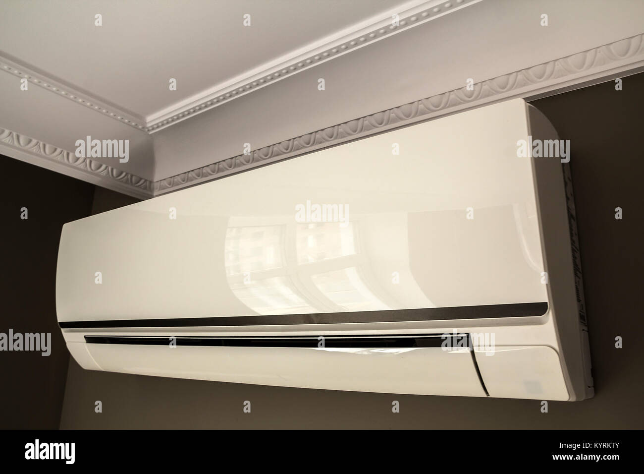 Cool air conditioner system on dark wall in room interior Stock Photo ...