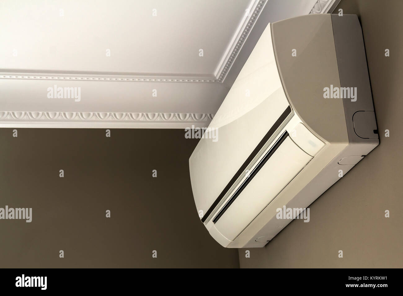 Cool air conditioner system on dark wall in room interior Stock Photo ...