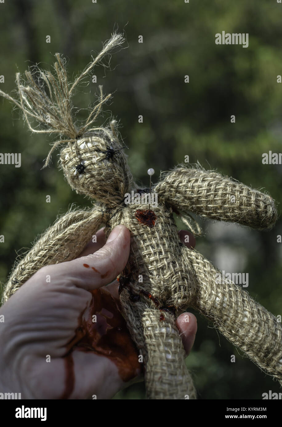 Bleeding voodoo doll with heart shaped blood Stock Photo - Alamy