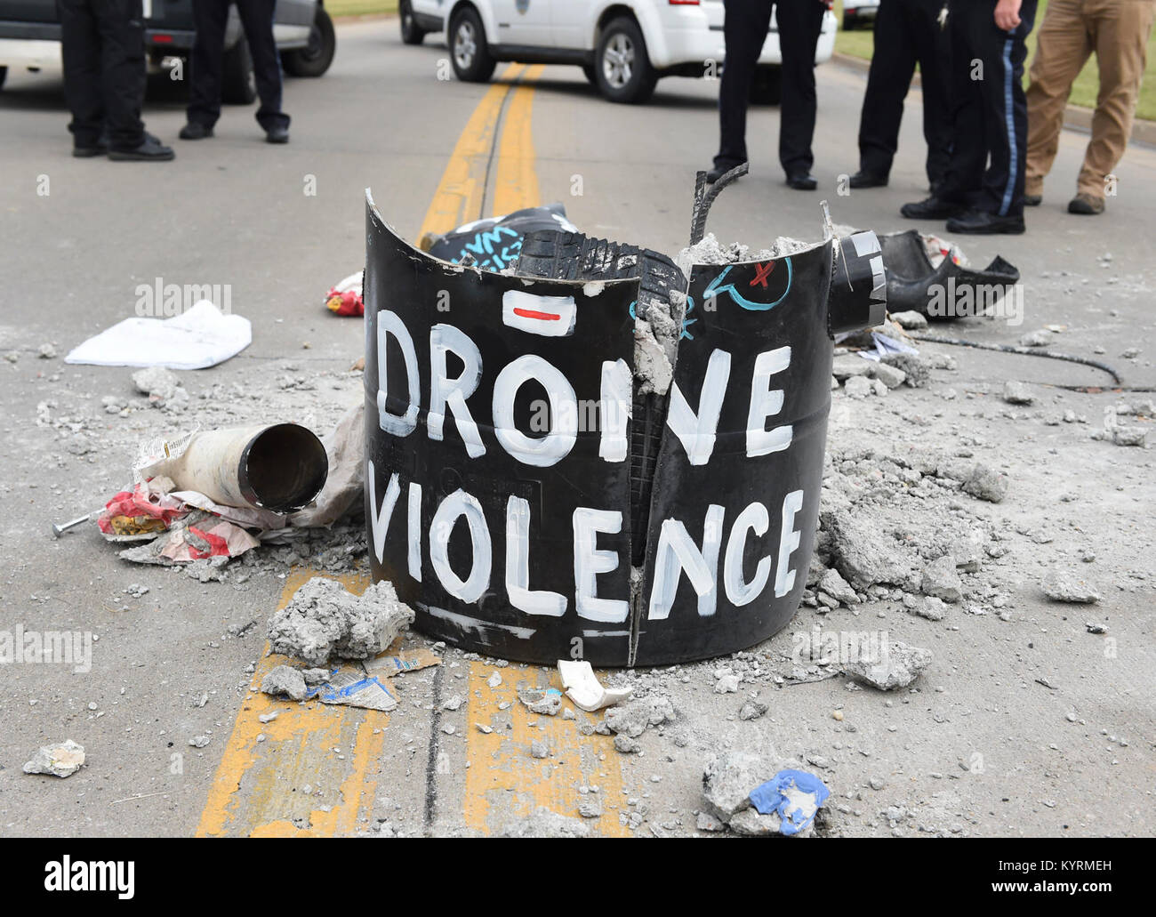 A split-open barrel displays a protester message amidst debris on June ...