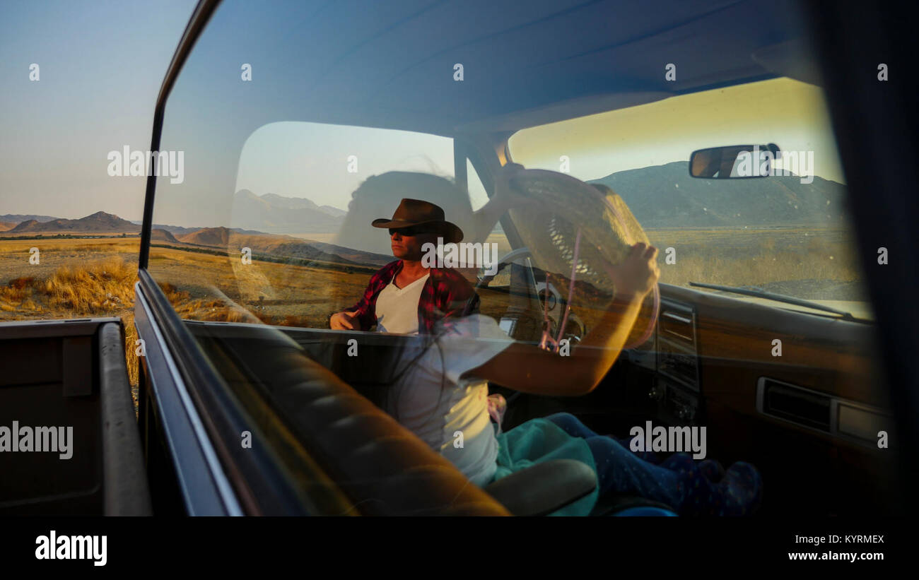A reflection of Air Force Reserve 1st Lt. Jeff Collins appears in the ...