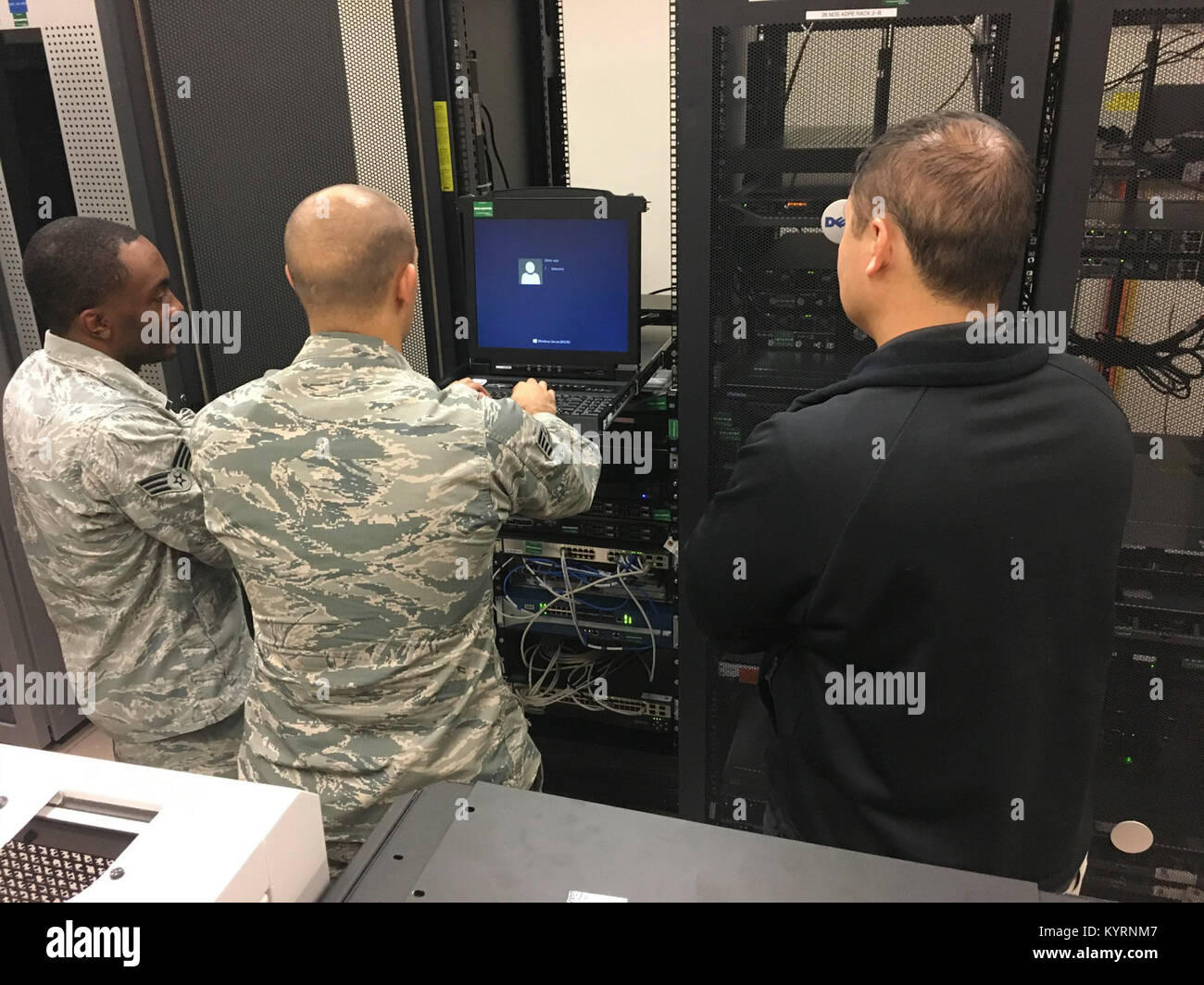 Members of the 26th Network Operations Squadron perform maintenance on ...