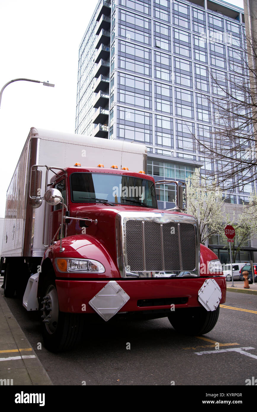 New modern red middle class semi truck with trailer for local ...