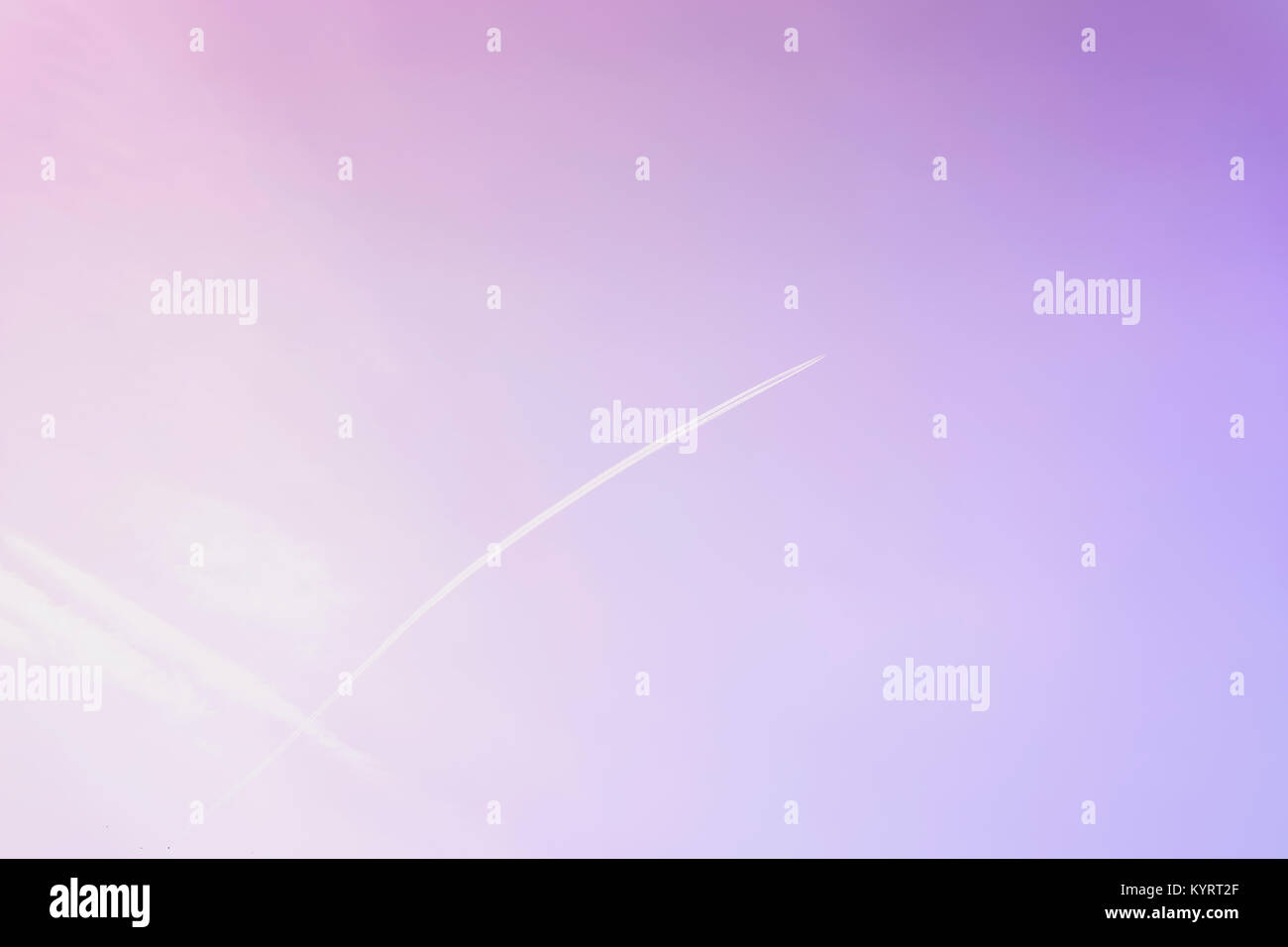 Bright clear blue sky with diagonal jet plane trace, track ...