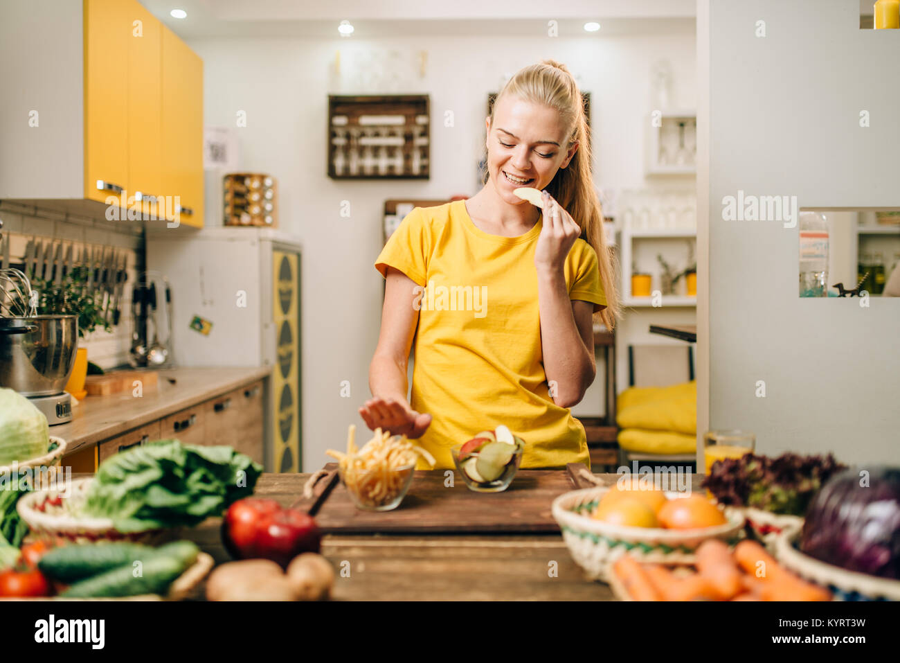 Female person cooking on the kitchen, healthy organic food preparing ...