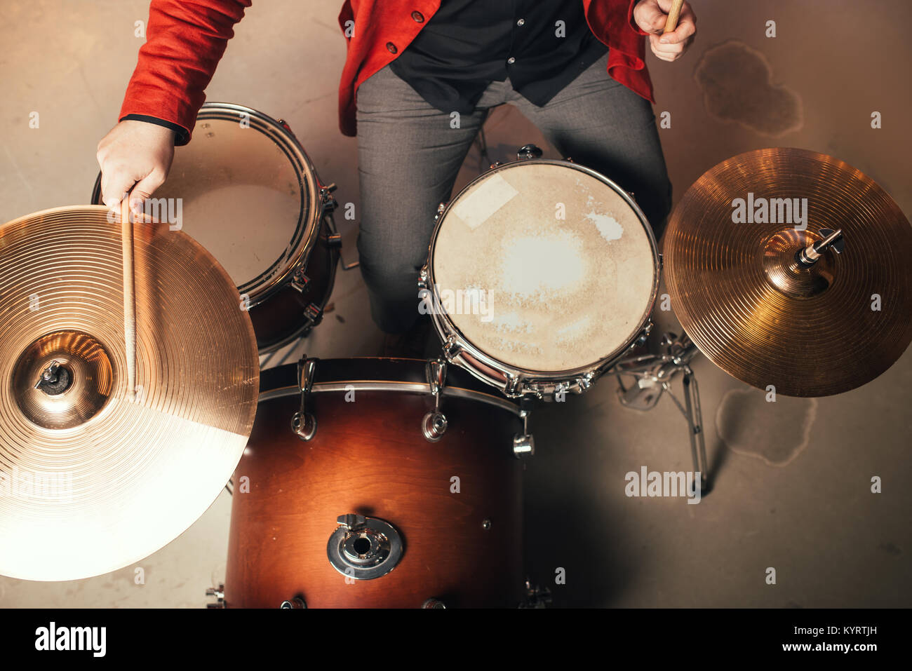 Drummer in red suit, top view, vintage style. Musical performer, drum ...