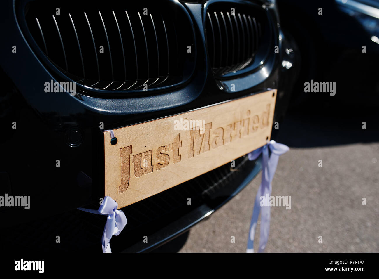 Black wedding BMW cars with creative wedding number plates saying "Just ...