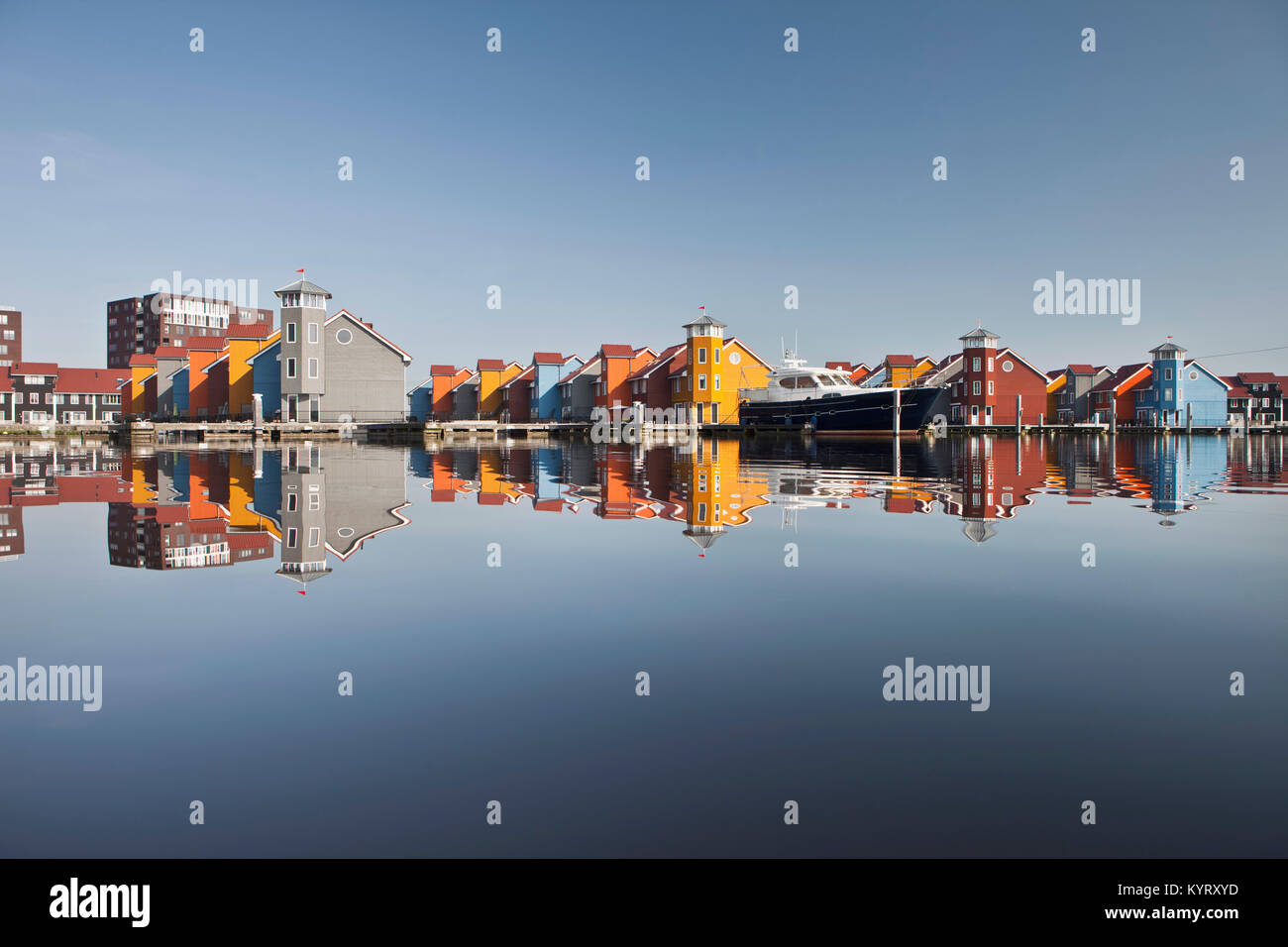The Netherlands, Groningen, Colourful residential houses and marina ...