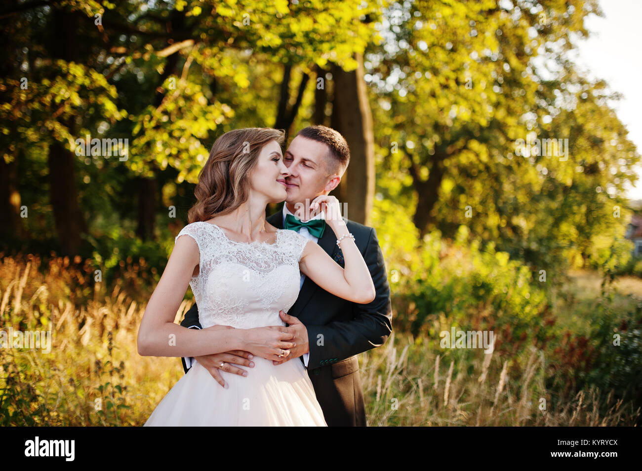 Newly married couple enjoying each other's company in the forest at ...