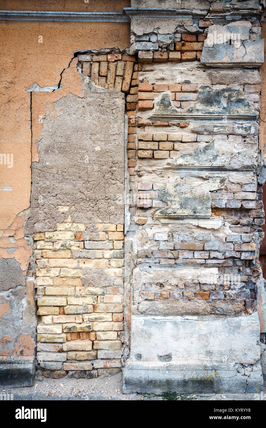 Old weathered wall of bricks and a ground Stock Photo - Alamy