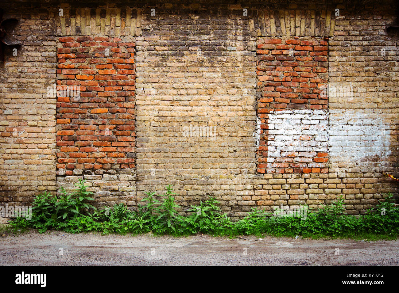 Old gungy wall with immured windows Stock Photo - Alamy