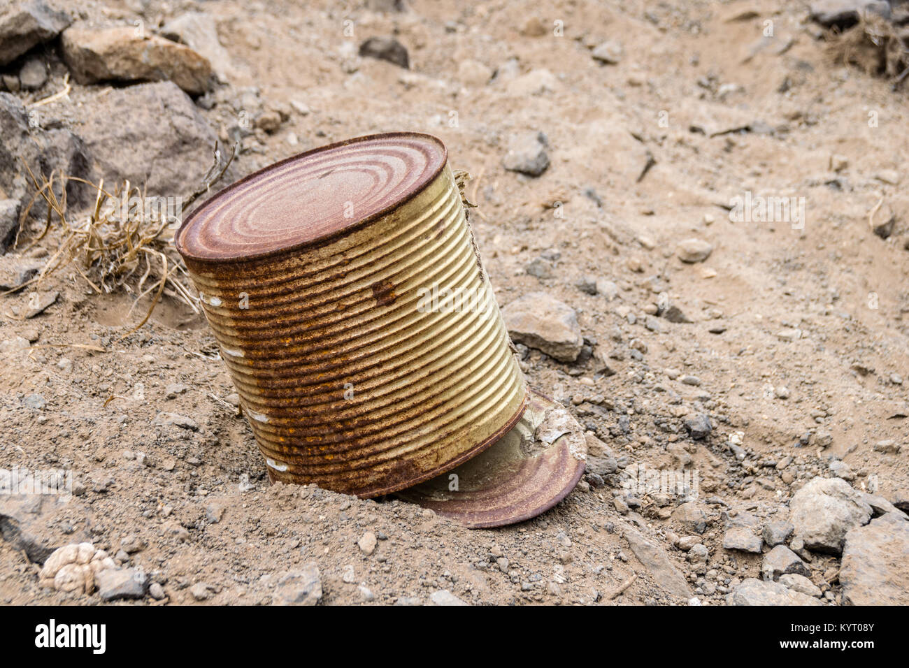 Rusting food tin can in desert landscape Stock Photo - Alamy
