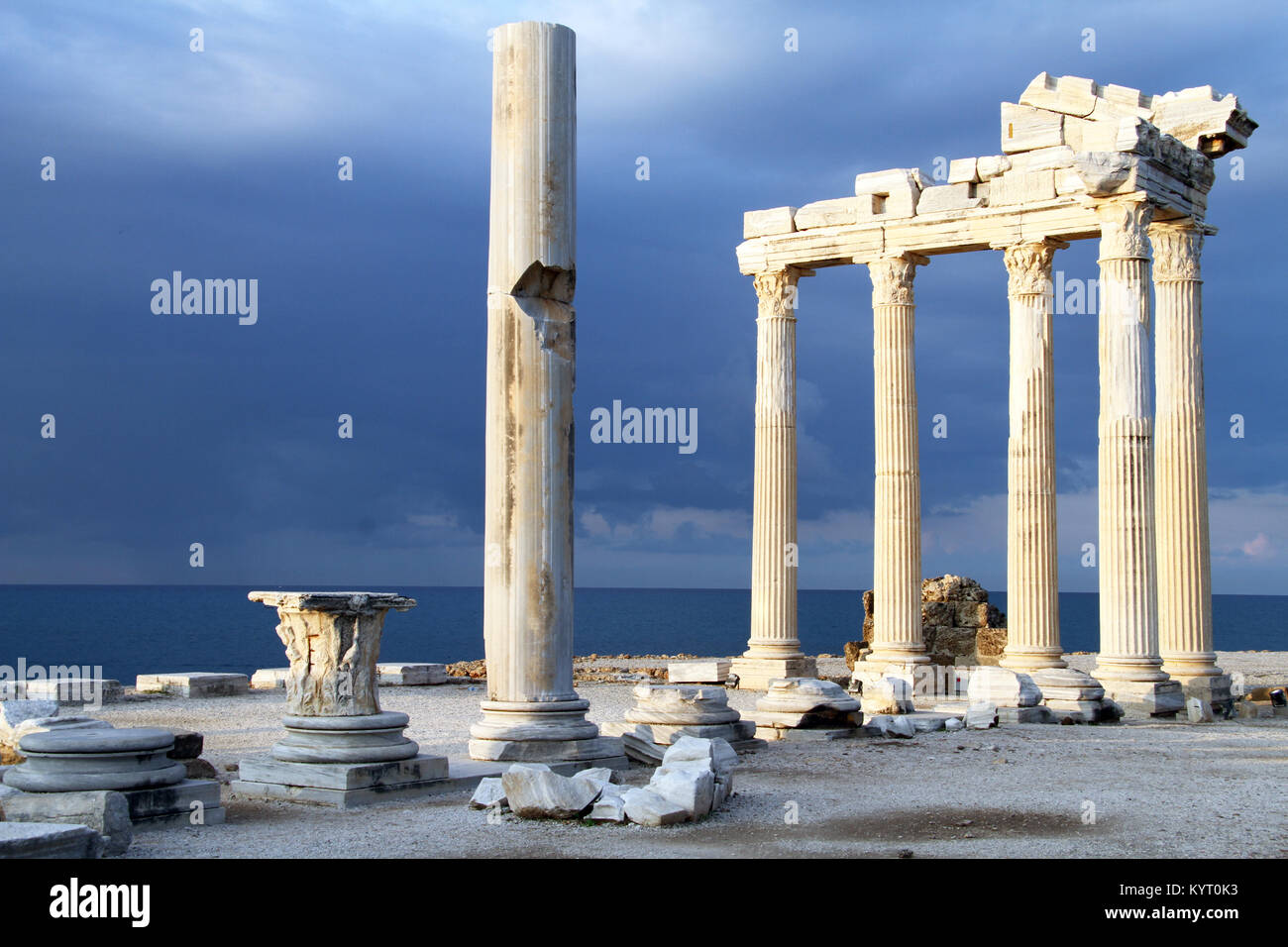 Dark blue sky and ruins of Apollo temple in Side, Turkey Stock Photo ...