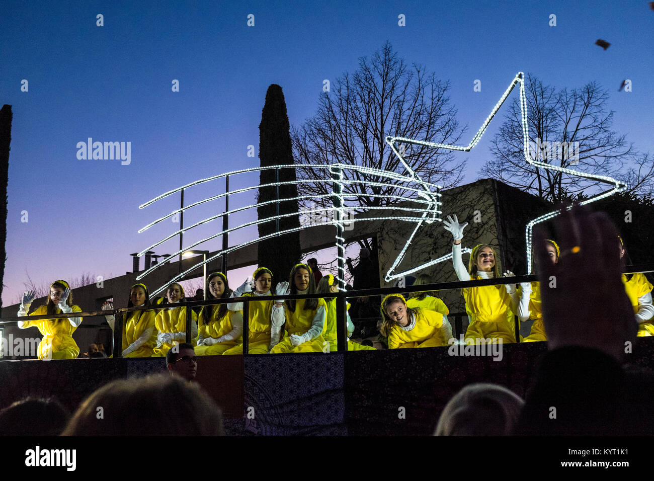 Girls throw sweets to the crowds on the arrival of the Kings, the three ...