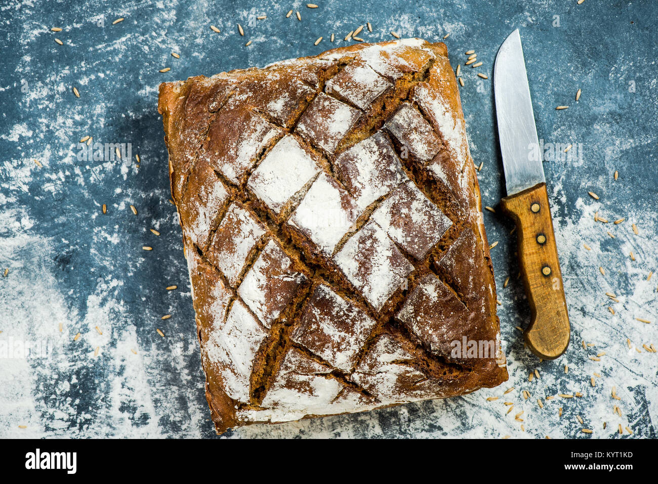 Loaf of homemade traditional bread and knife Stock Photo - Alamy
