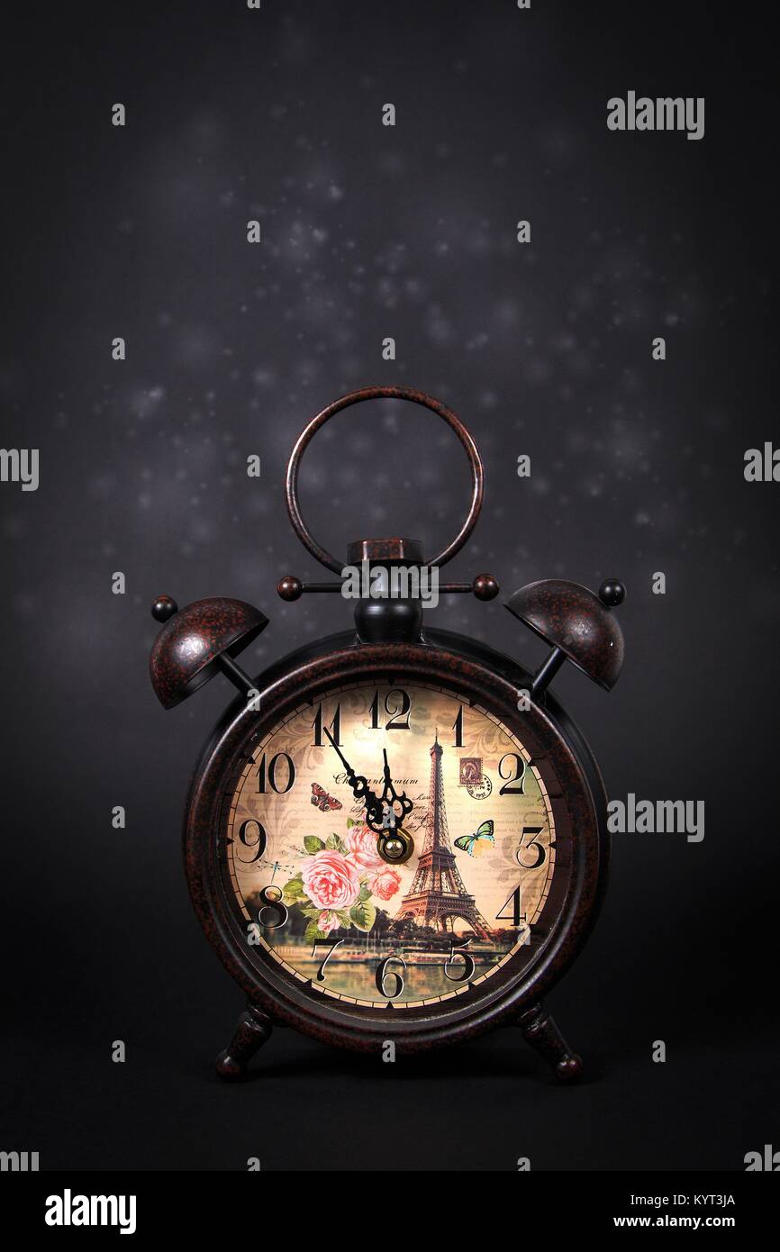 Photo of an old vintage clock on black background with sparkles Stock ...