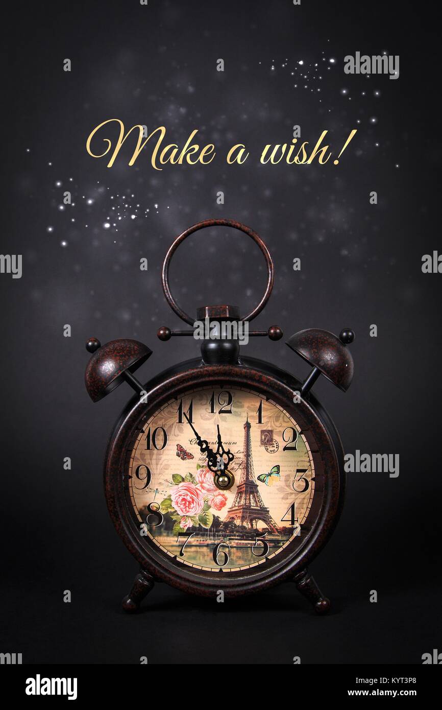 Portrait photo of an old vintage clock on black background with ...