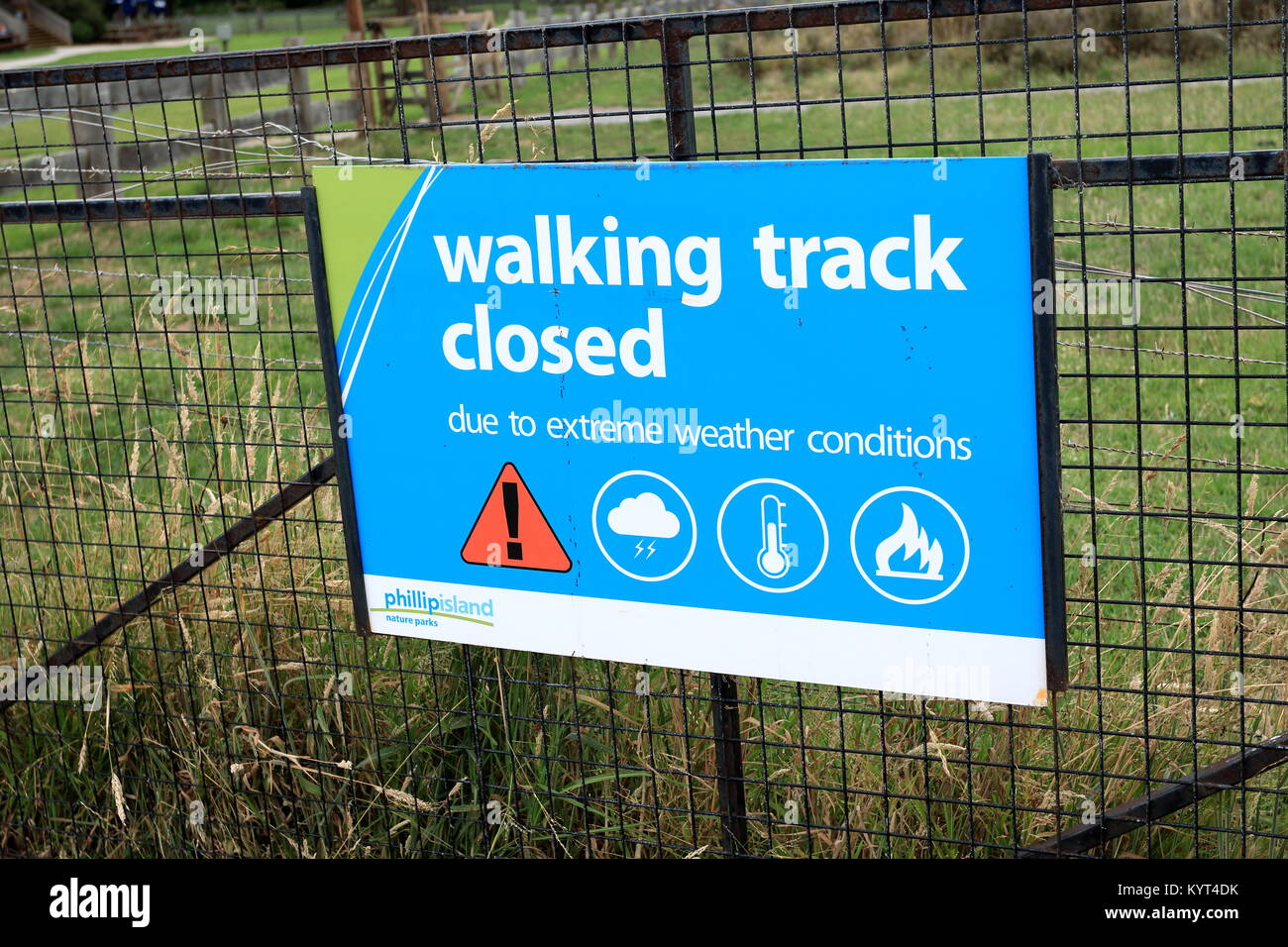 Walking track closed sign on metal gate Stock Photo - Alamy