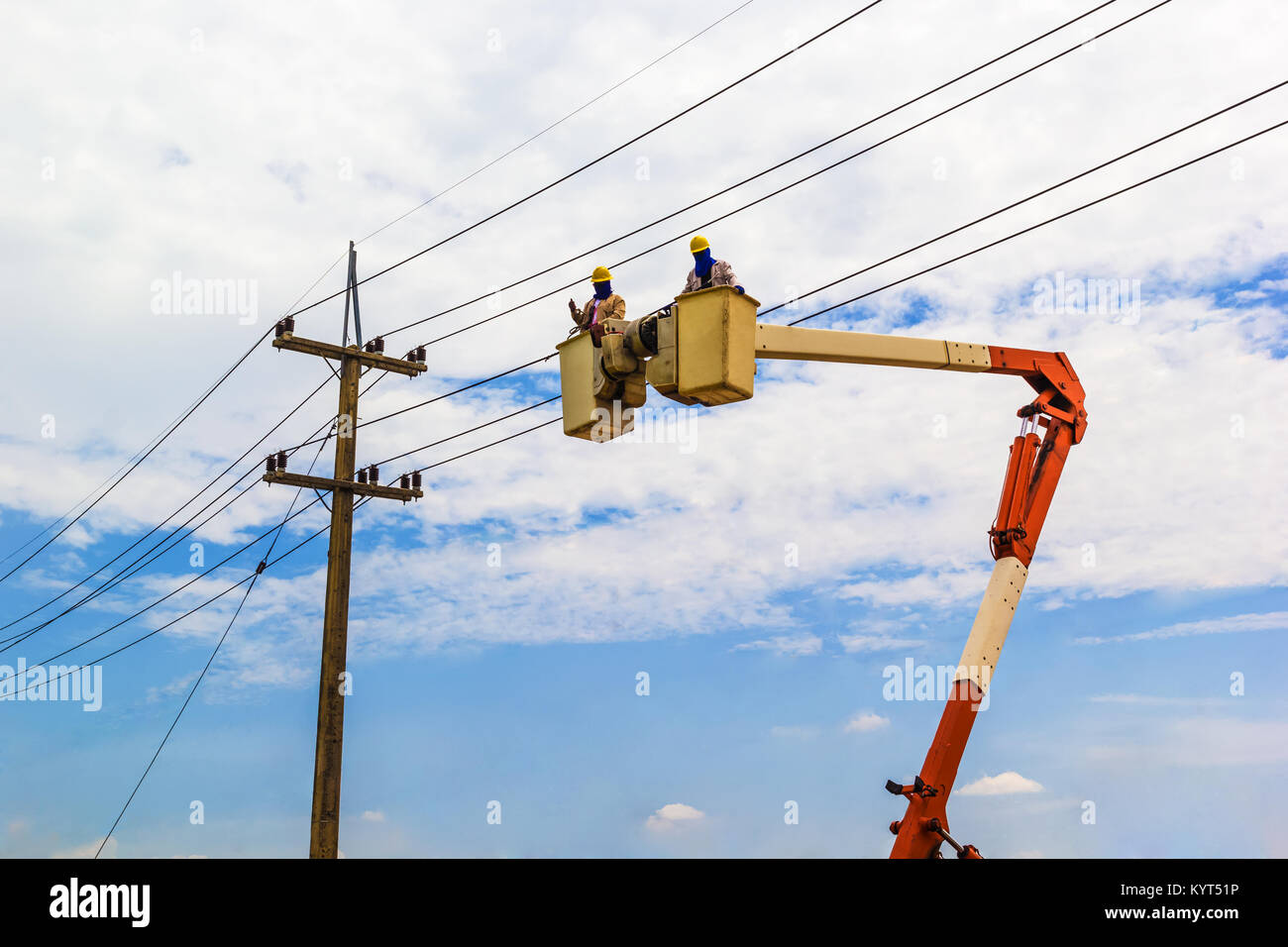 A phooto of Electricity Authority on cable car to maintenance a ...