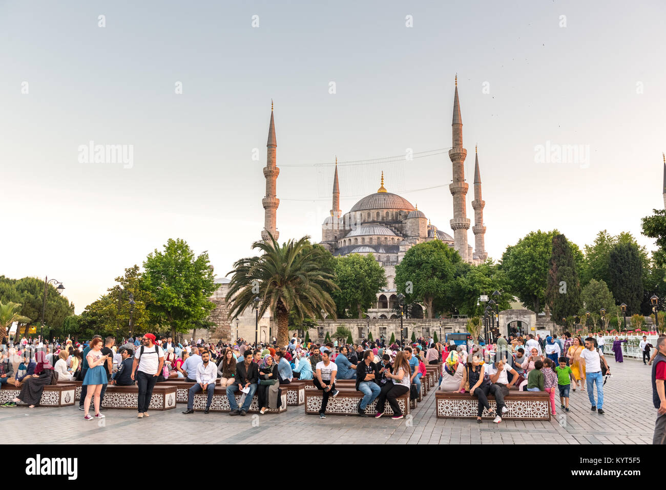 Muslim people who are fasting wait for the adhan (ezan) and evening ...