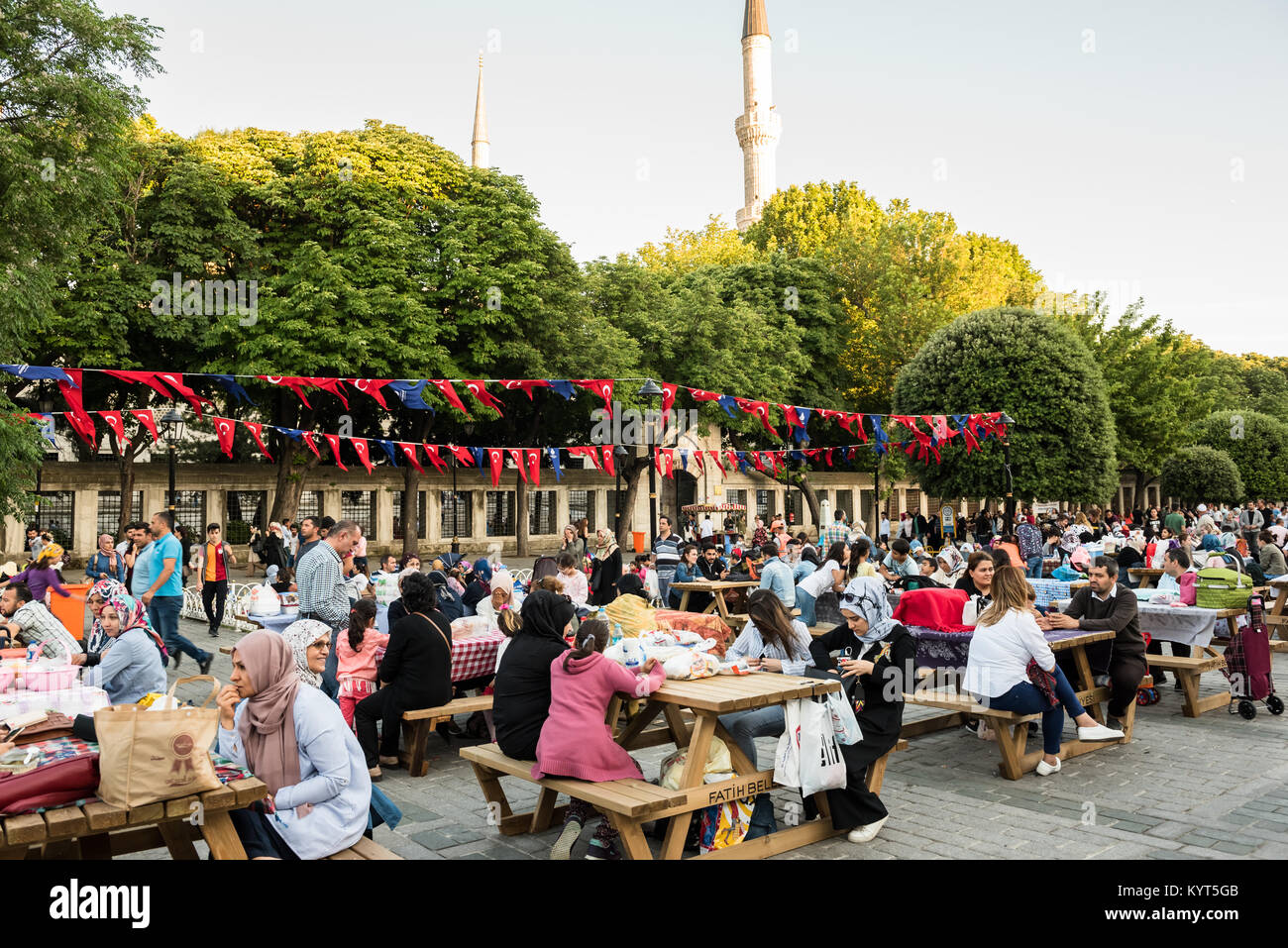 Muslim people who are fasting wait for the adhan (ezan) and evening ...