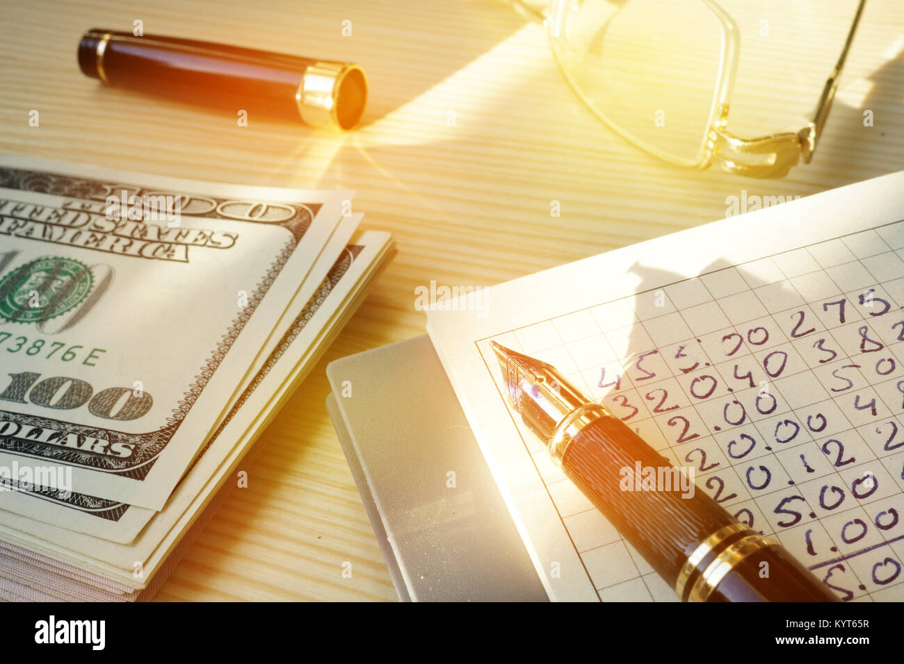 Note with budget planning calculations and money Stock Photo - Alamy