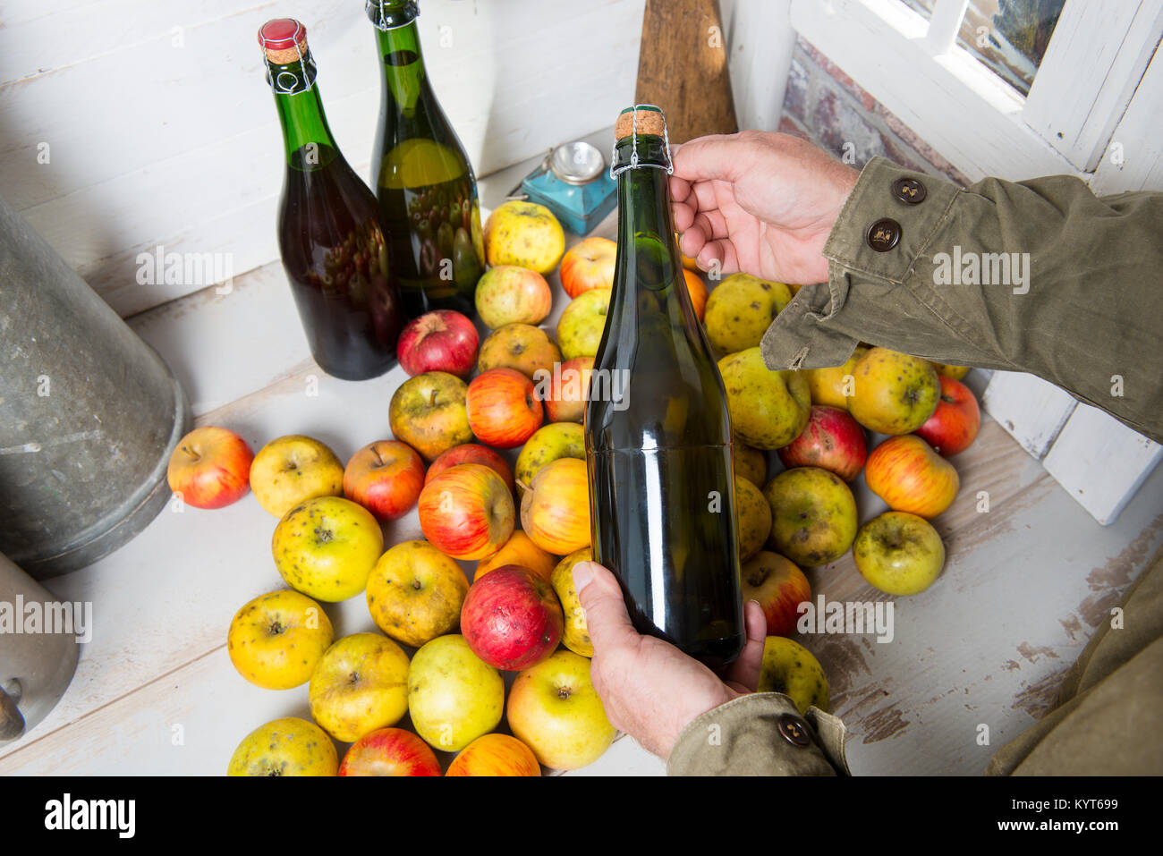 a man with a bottle of cider, close-up Stock Photo - Alamy