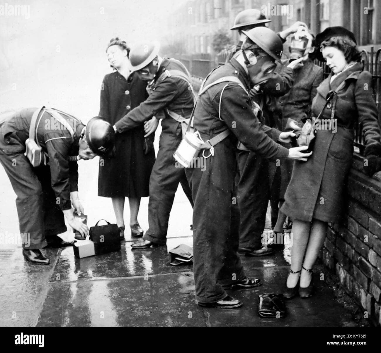Helping to put on gas masks, ARP training exercise during WW2 Stock ...