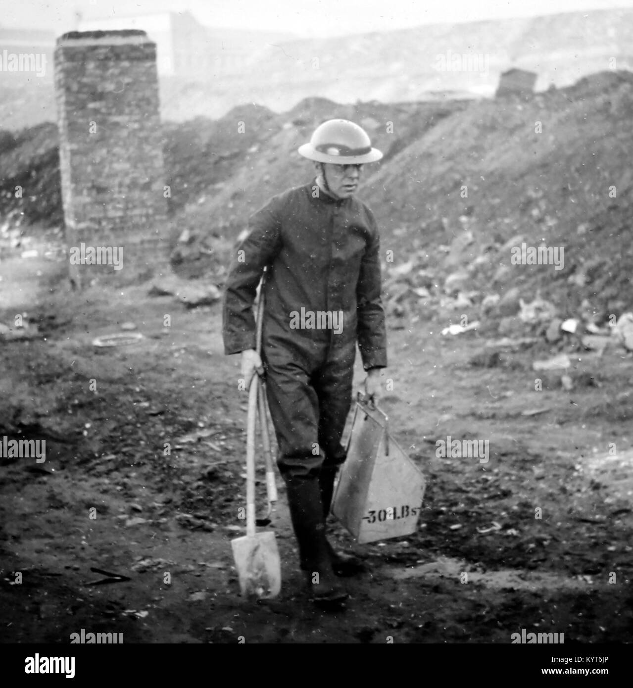 Removing an unexploded incendiary bomb, ARP training exercise during ...