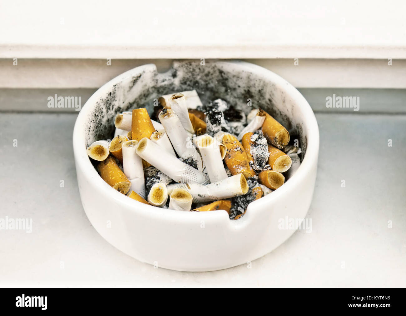 Cigarette butts in a ceramic ashtray, smoking in public places Stock ...