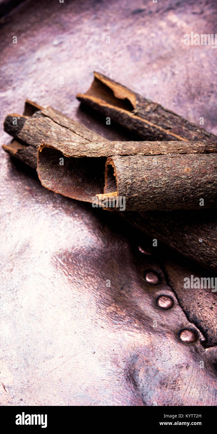 cinnamon sticks on old rust background in rustic style Stock Photo - Alamy