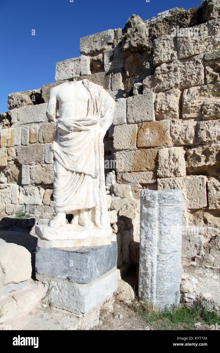 Headless statue near stone wall in Salamis, North Cyprus Stock Photo ...