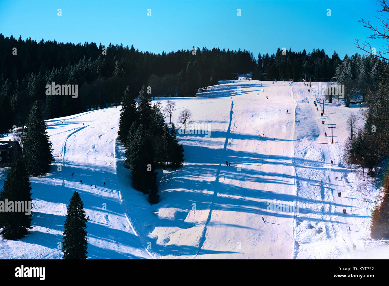 Piste ski tracks on snowy and sunny mountain side Stock Photo - Alamy