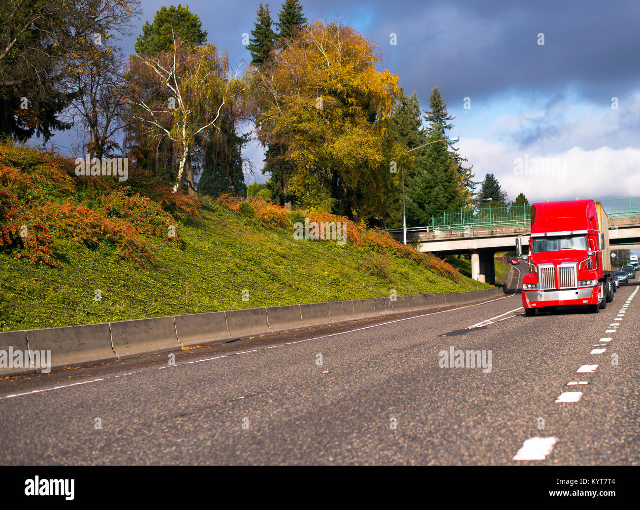 Modern bright red big rig semi truck tractor for long distance hauling ...