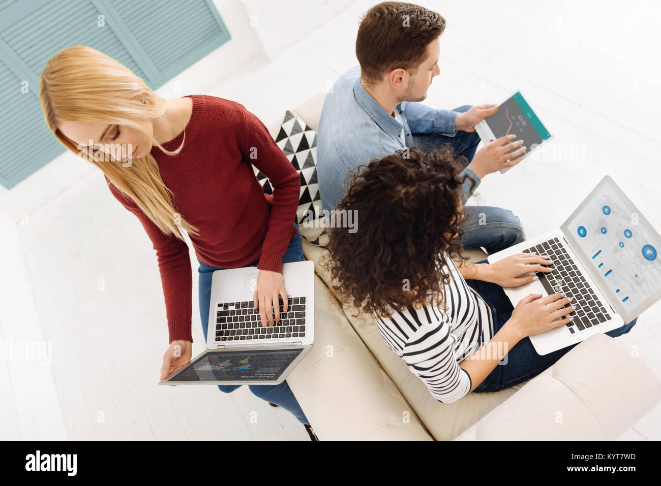Beautiful blonde girl working with her computer Stock Photo - Alamy