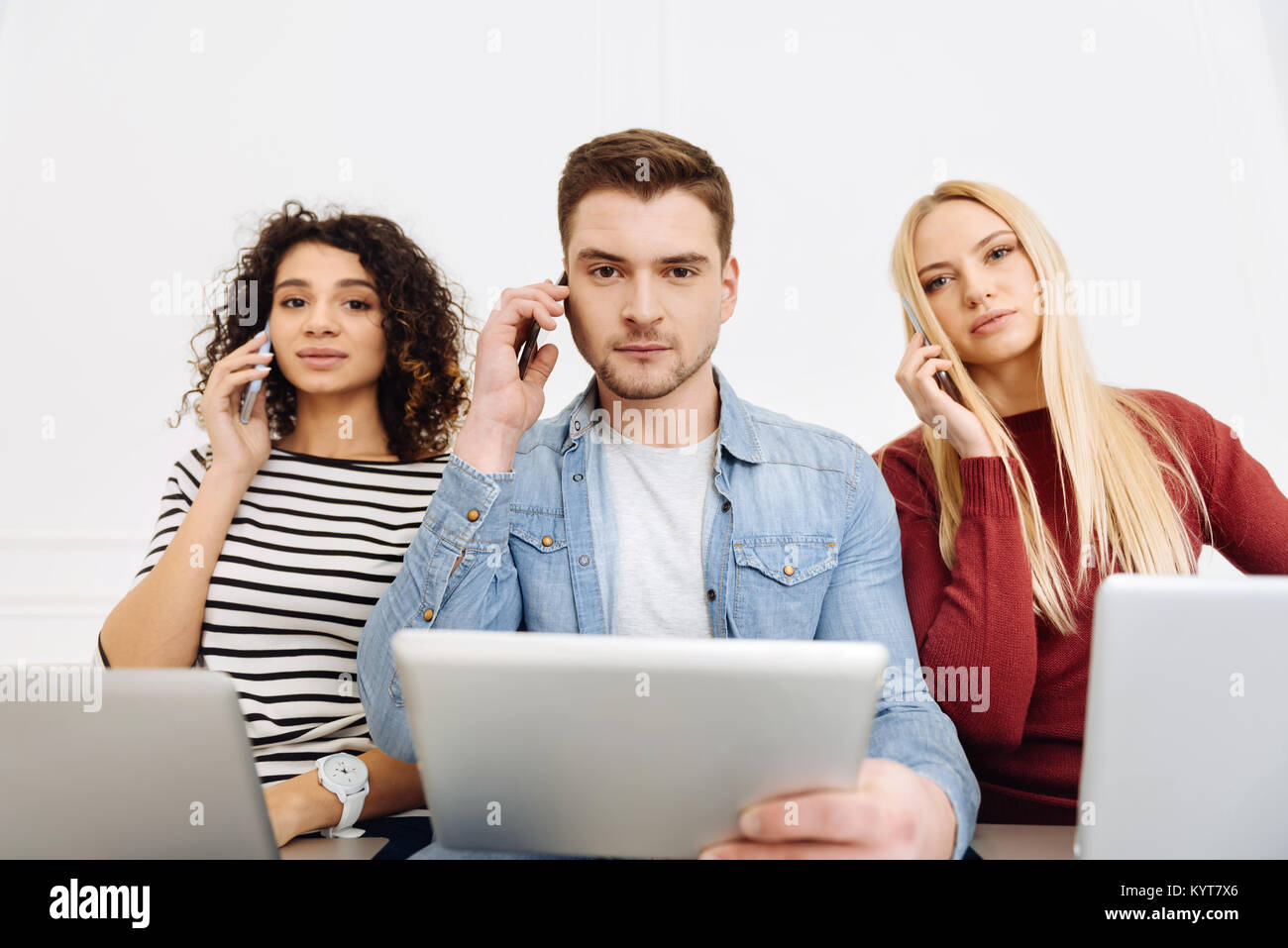 Attentive male person looking at camera Stock Photo - Alamy