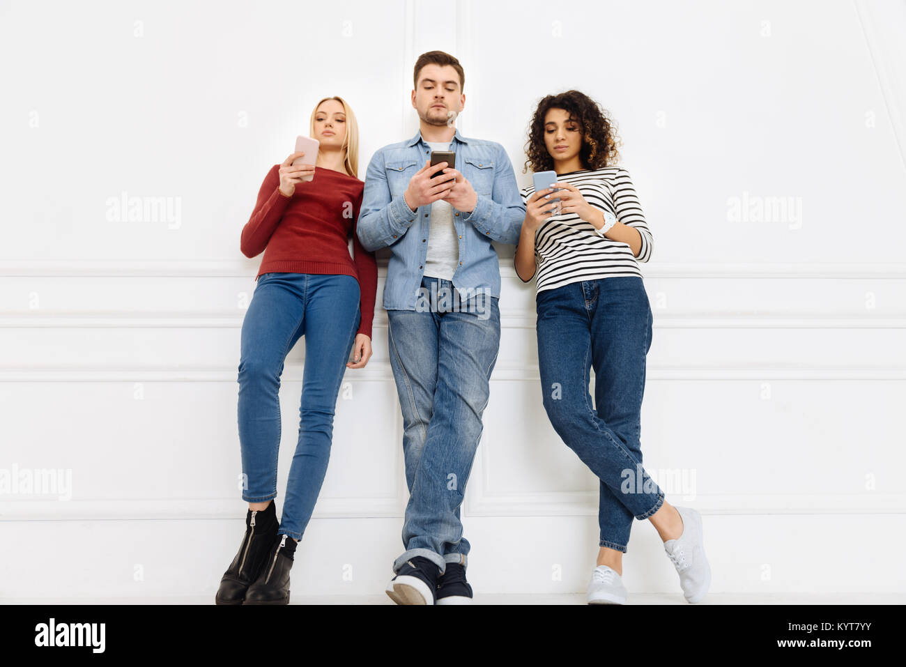 Stylish young people being very busy Stock Photo - Alamy