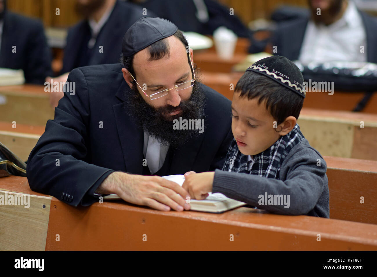 A teacher and student (presumably father & son) learning together at a ...